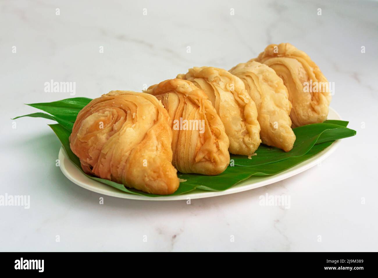 Malaysia popular and traditional snack Karipap or curry puff filled ...