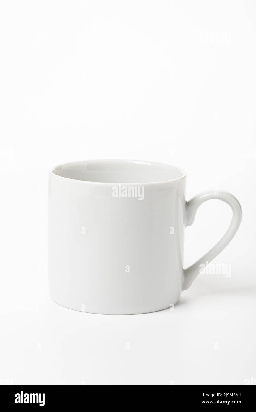 Perfect small white coffee cup on white background Stock Photo - Alamy
