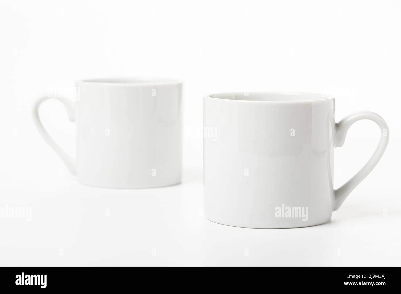 Perfect small white coffee cup on white background Stock Photo - Alamy