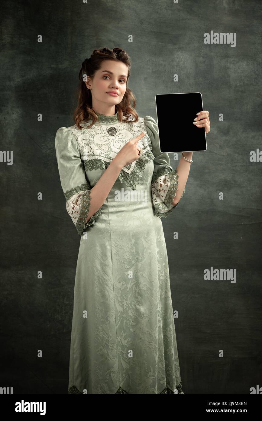 Emotional young beautiful girl, actress in image of medieval person ...