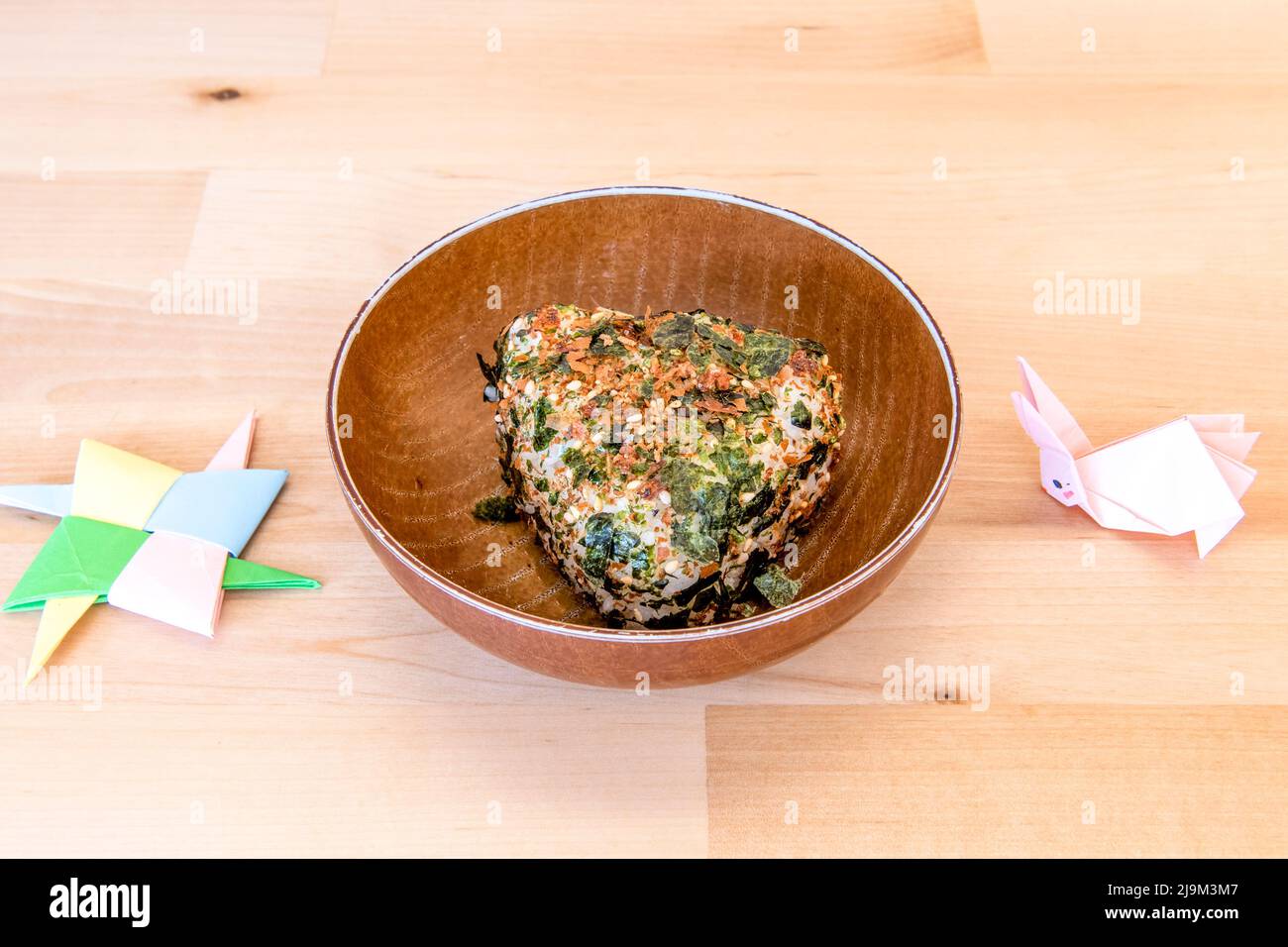 Onigiri or Omusubi is a Japanese dish that consists of a ball of rice ...