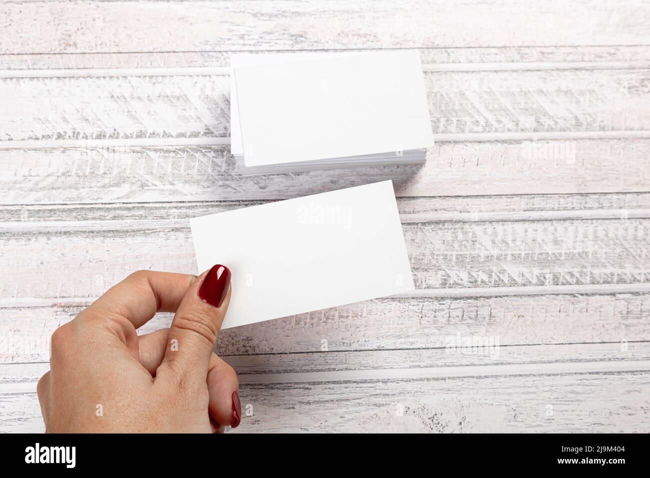 Business cards blank. Mockup on gray wooden background. Copy space for ...