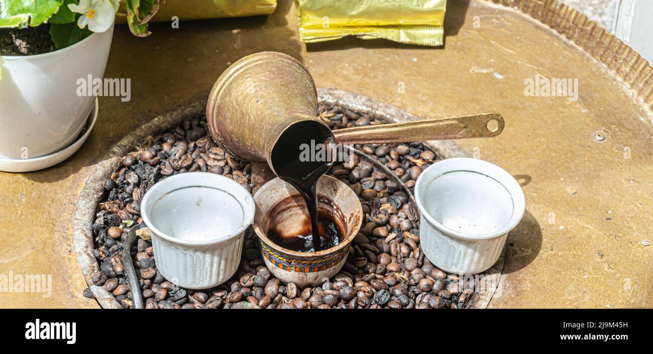 The pouring Bosnian coffee fountain Stock Photo - Alamy