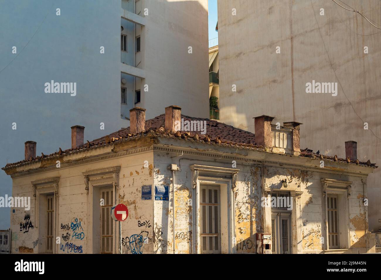 A traditional house in Athens surrounded by newer development Stock ...