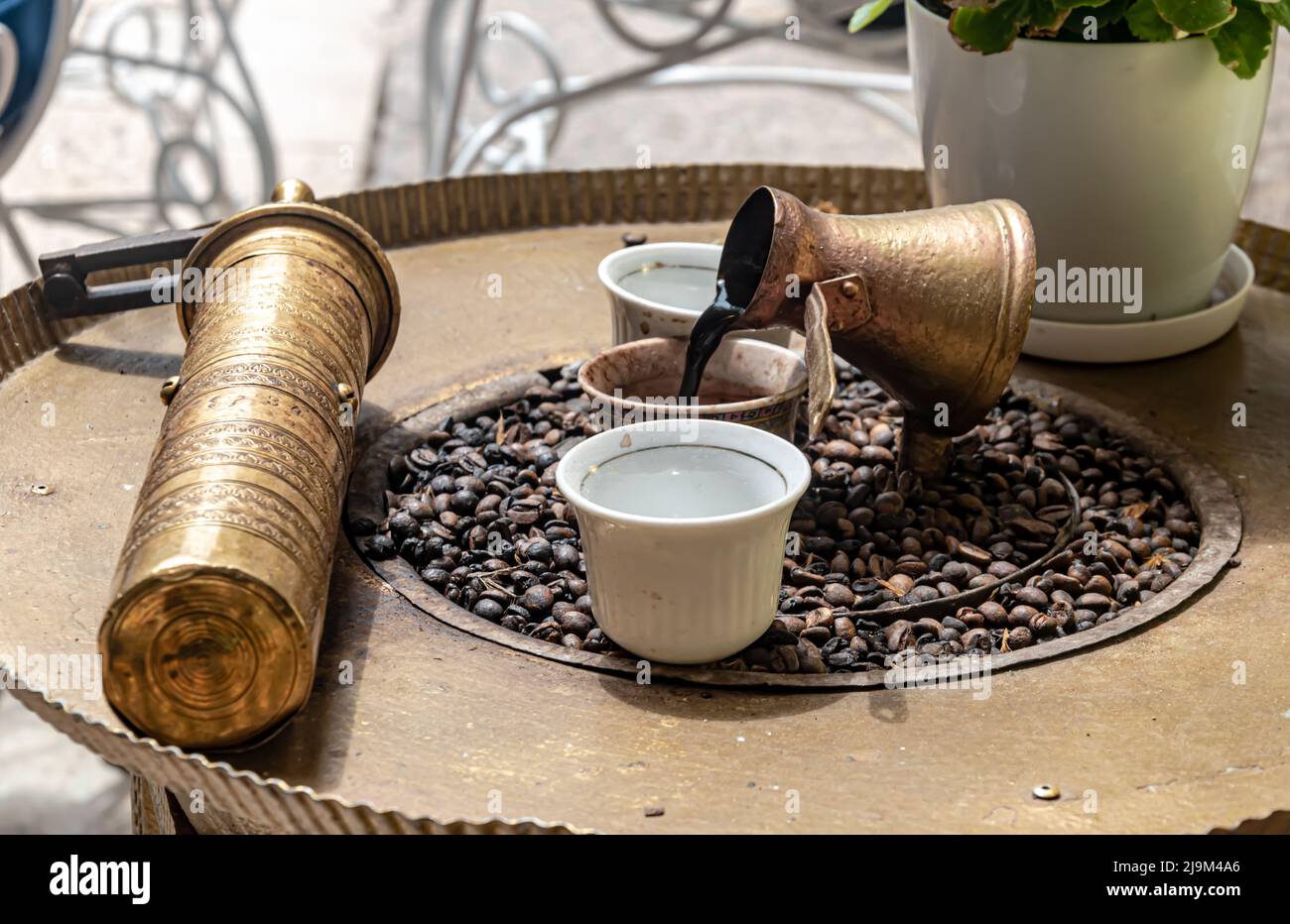 The pouring Bosnian coffee fountain Stock Photo - Alamy