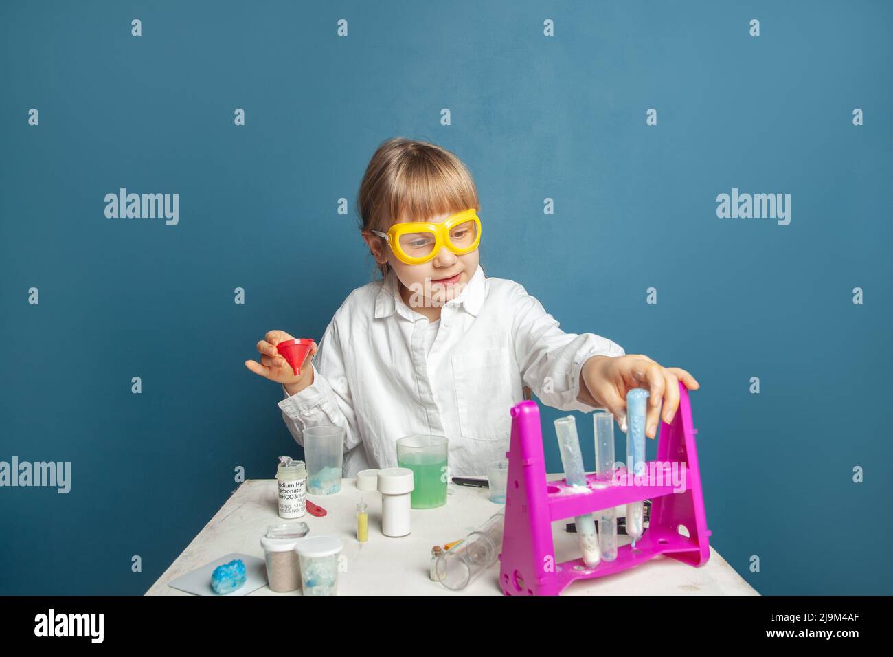 Science and education. Cute kid student doing research in science ...