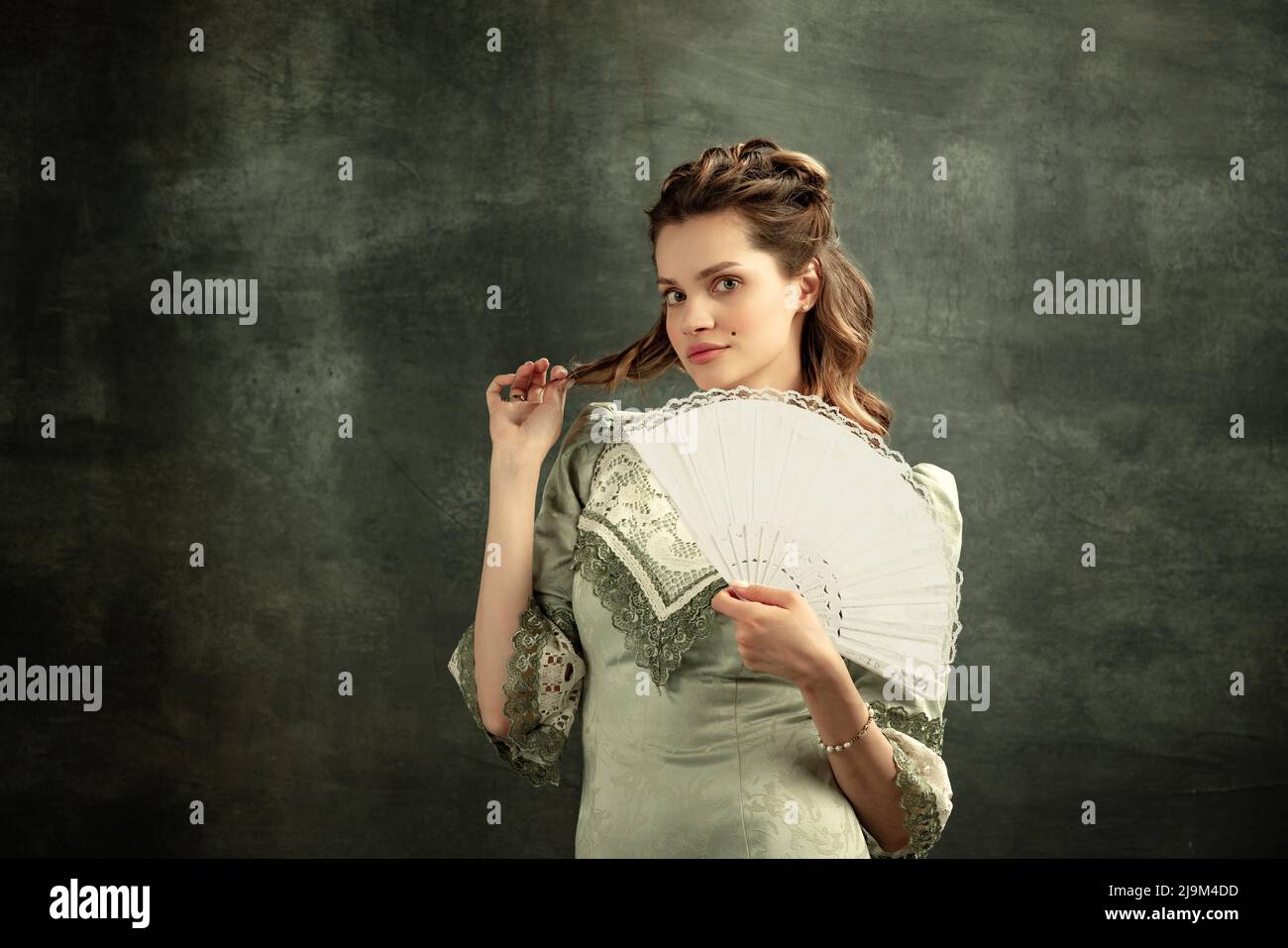 Conceptual portrait of young charming girl in image of medieval royal ...