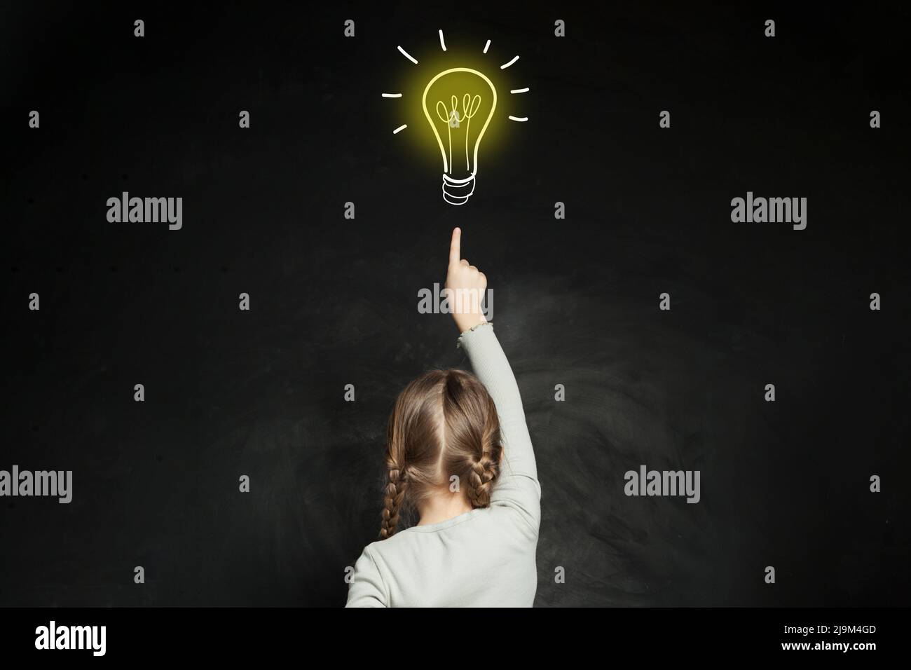 Child with light bulb. Idea concept Stock Photo - Alamy