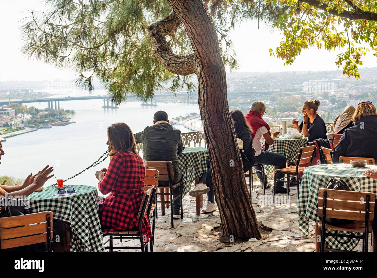 People enjoy Turkish tea, coffee, and the view of the Golden Horn from ...