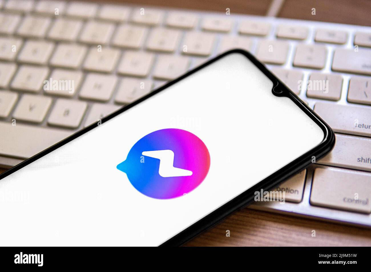 In this photo illustration, a Messenger logo seen displayed on a ...