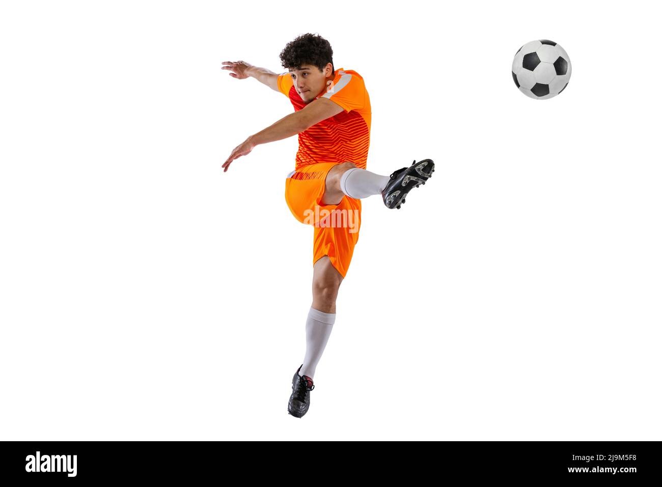 Professional football, soccer player in motion isolated on white studio ...