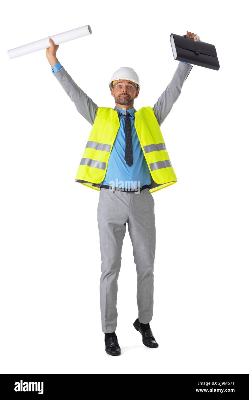Full length portrait of a male engineer with arms raised holding a ...