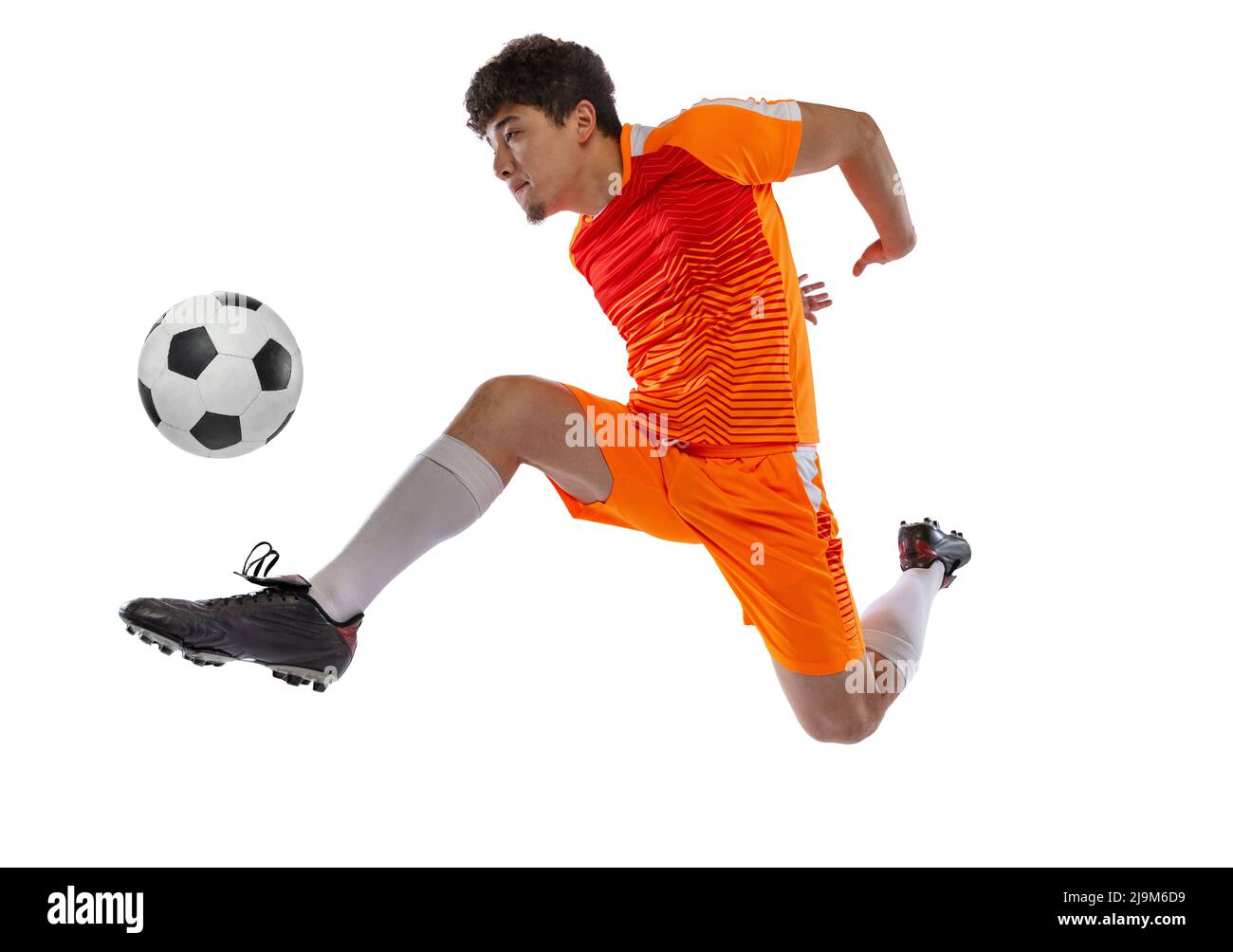 Professional football, soccer player in motion isolated on white studio ...