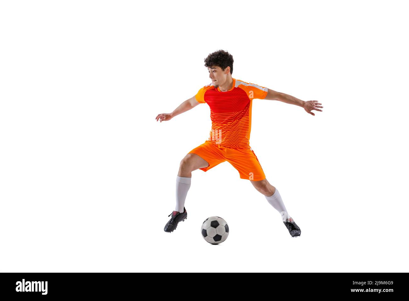 Professional football, soccer player in motion isolated on white studio ...