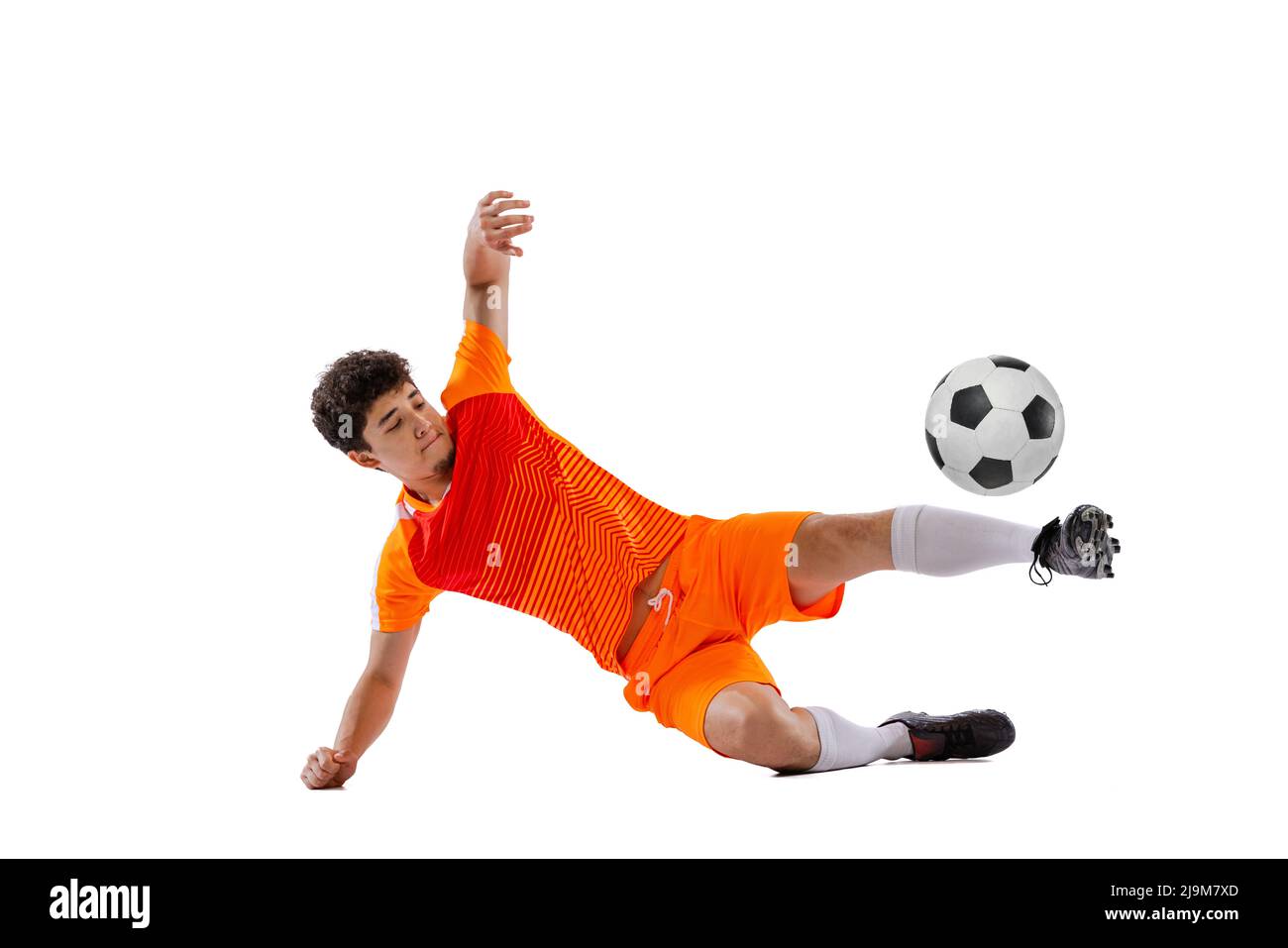 Professional football, soccer player in motion isolated on white studio ...