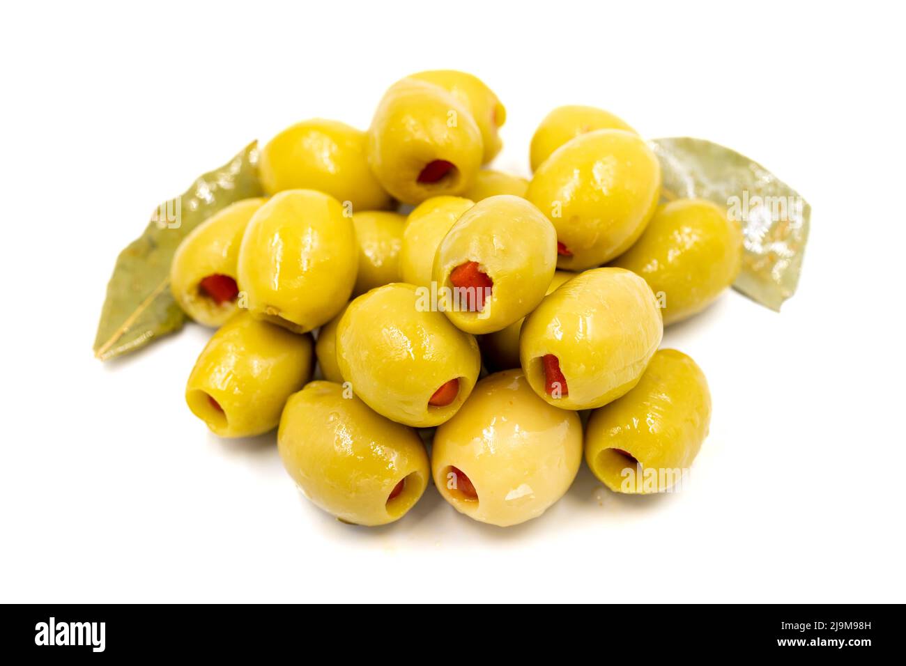 Green olives stuffed with peppers. Natural peppered olives on isolated ...