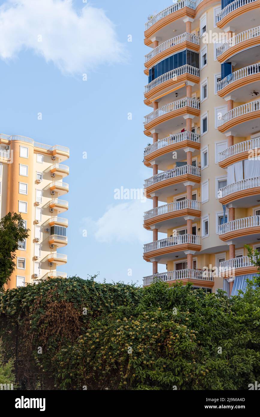 View of tall residential buildings among dense vegetation in Turkey ...