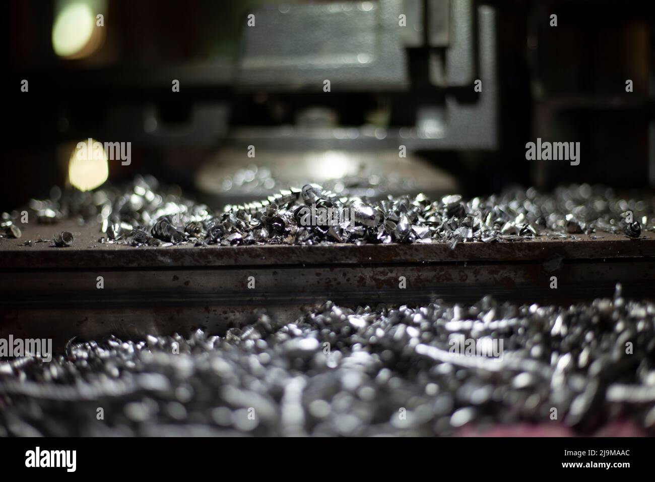 Metal shavings. Production waste. Steel chips after drilling. Garbage ...