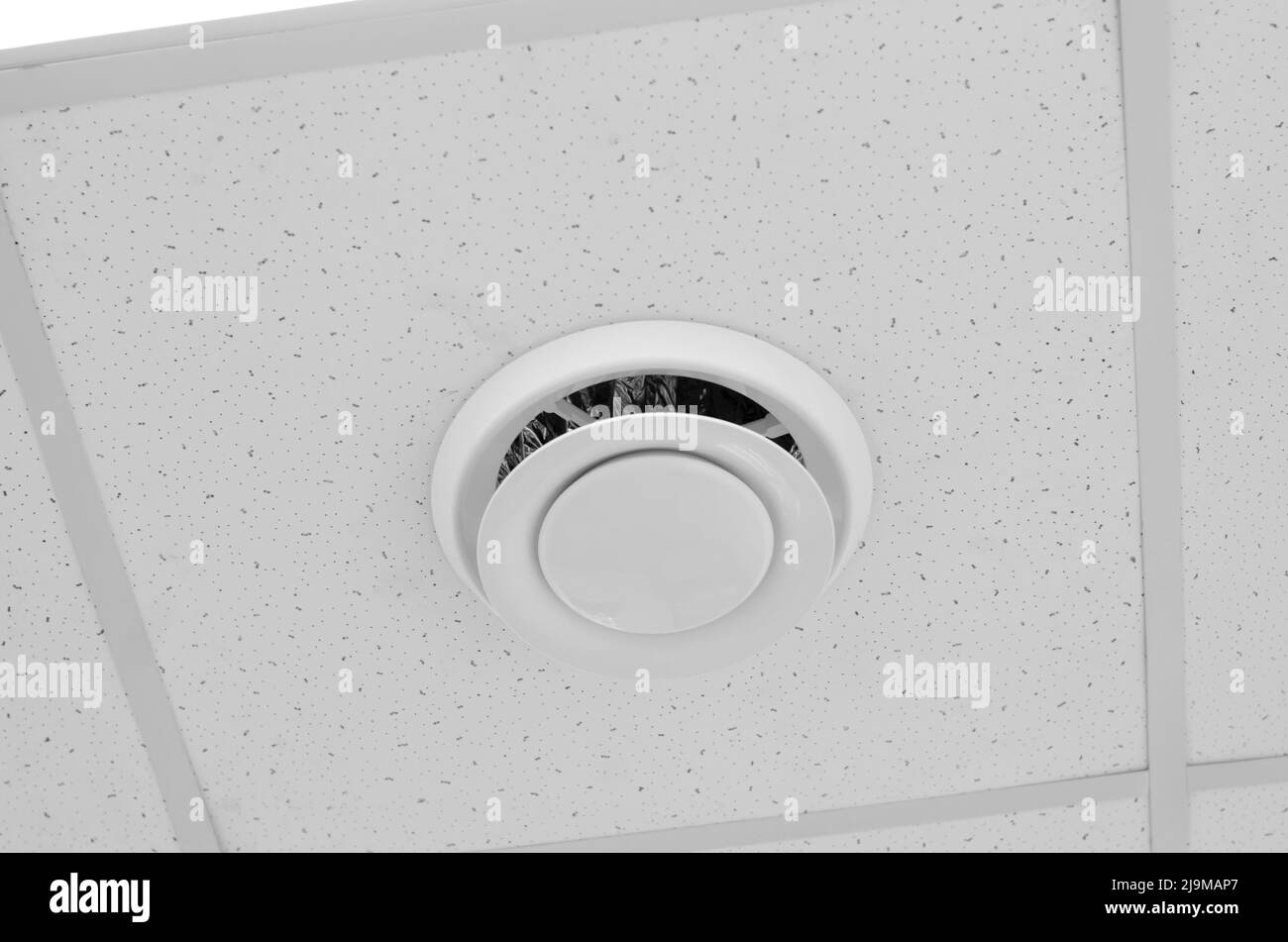 Round ventilation duct on the ceiling. Modern ventilation built into ...