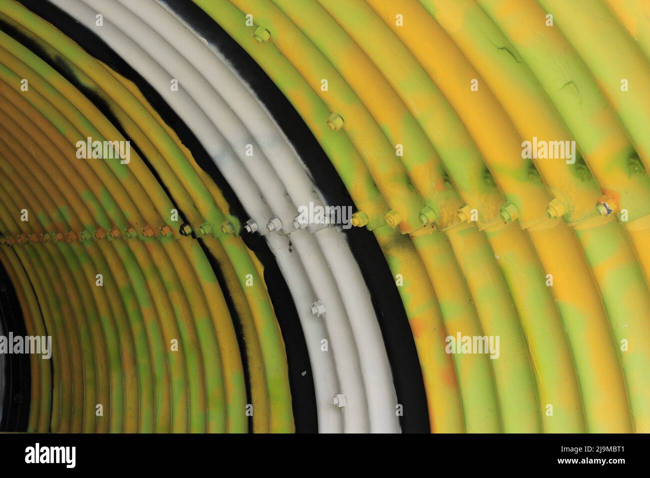 Painted corrugated steel tunnel in the big city Stock Photo - Alamy