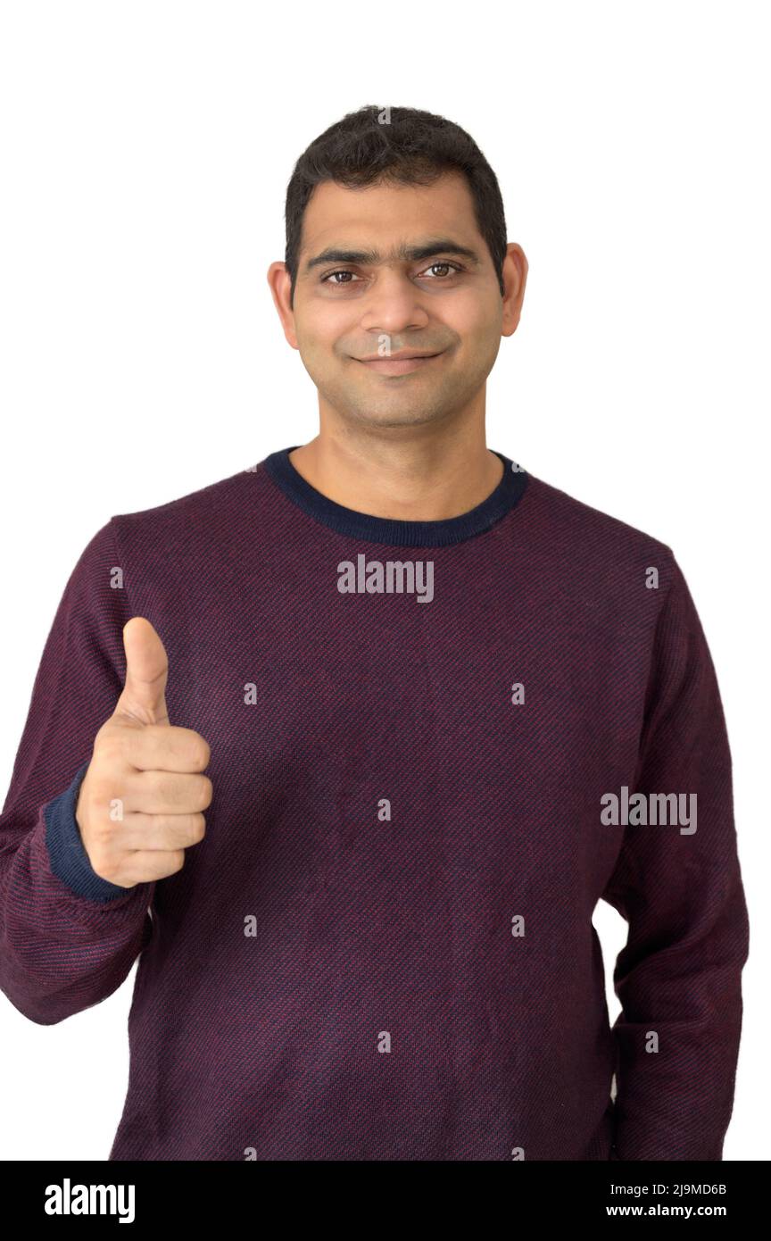 Portrait of an Indian male model showing positive signs thumbs up and ...