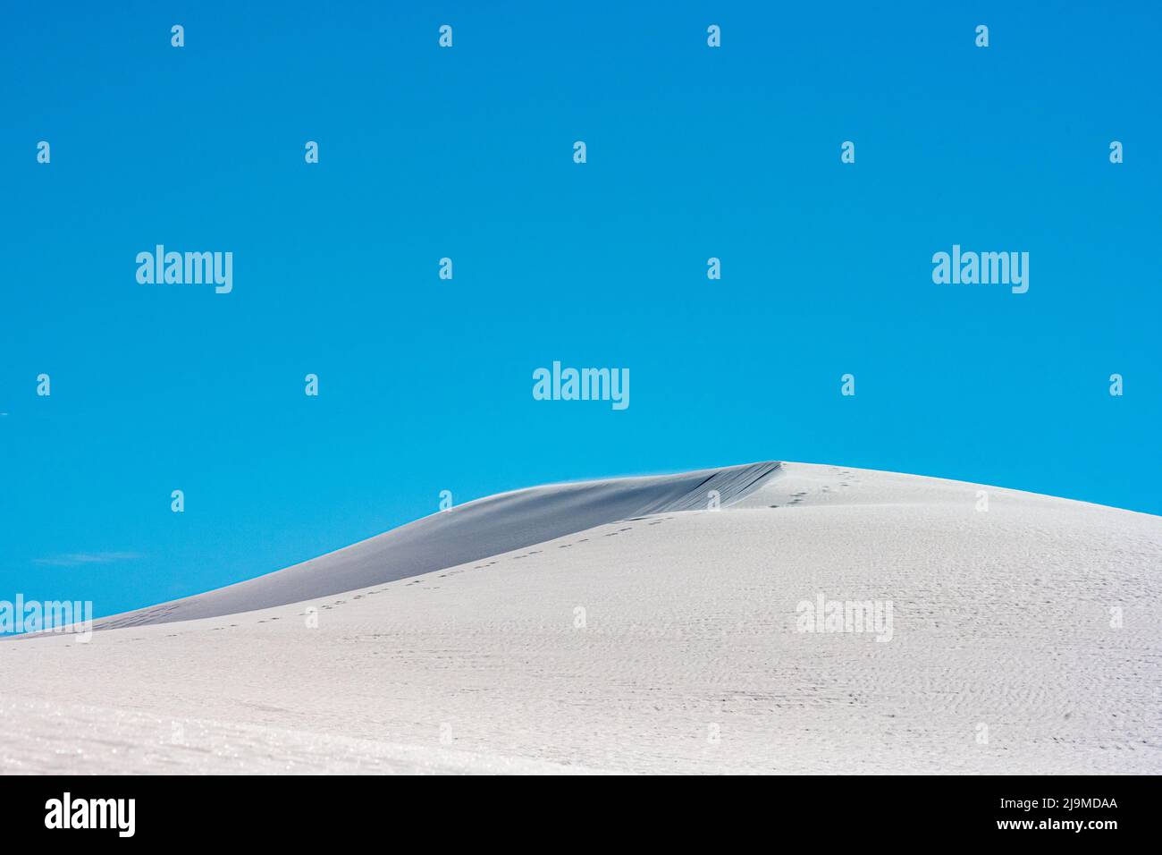 Sand Begins Saltation Off The Peark Of A Dune in White Sands National ...