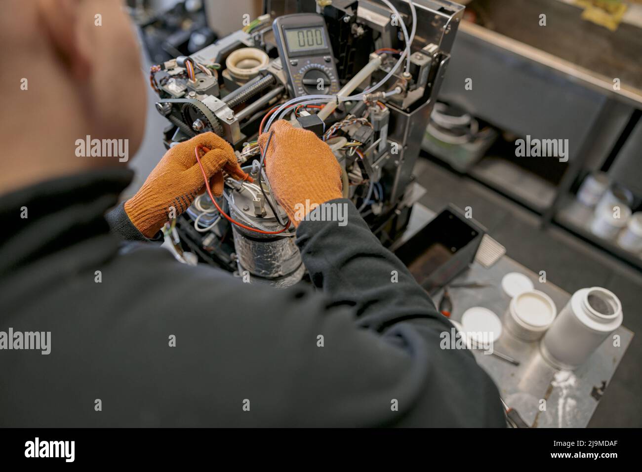 Repairman screwdriver fixing coffee hi-res stock photography and images ...