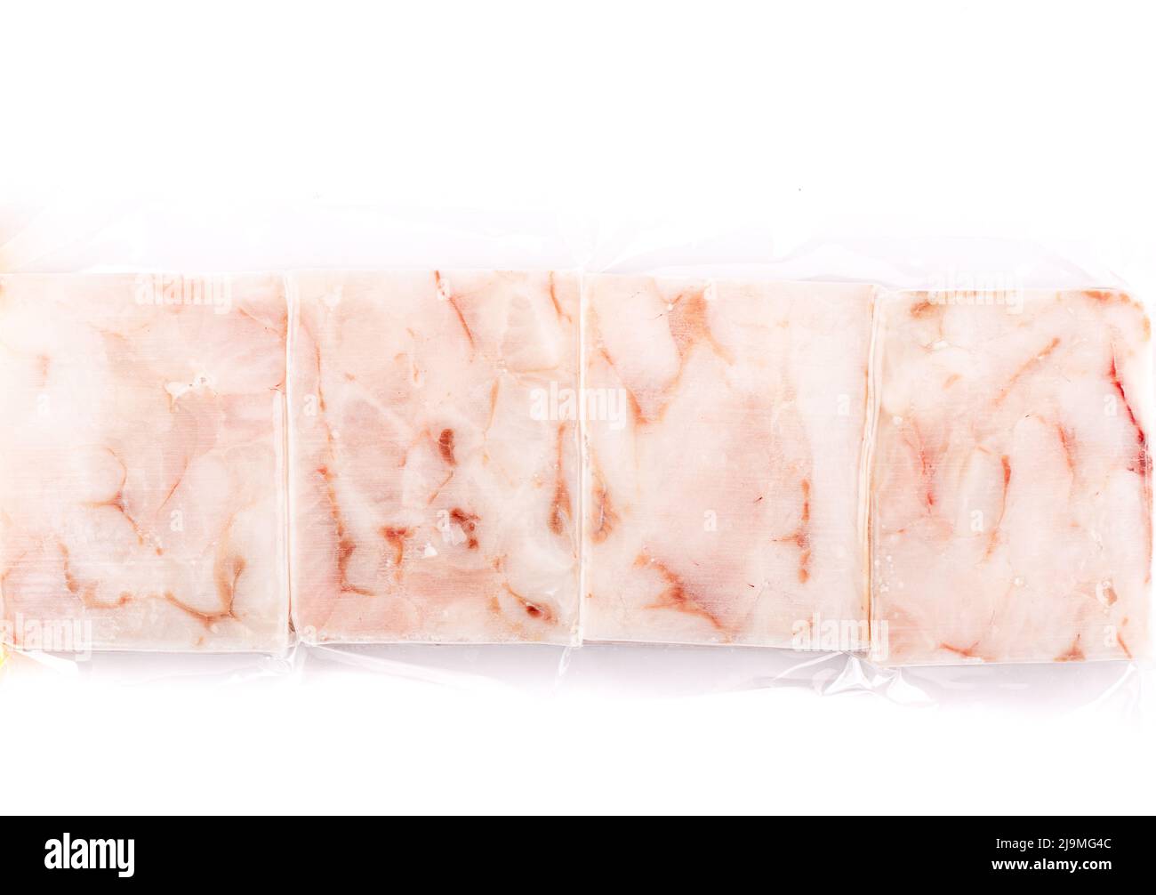 Pressed frozen pollock fillets in vacuum packaging on a white ...