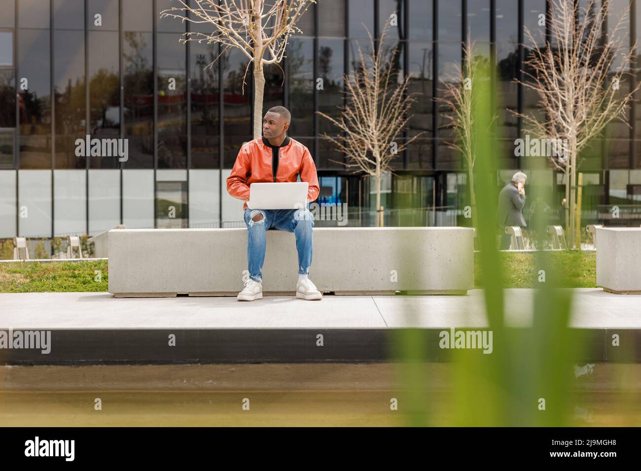 Serene slim female standing on mat in Virabhadrasana with outstretched ...