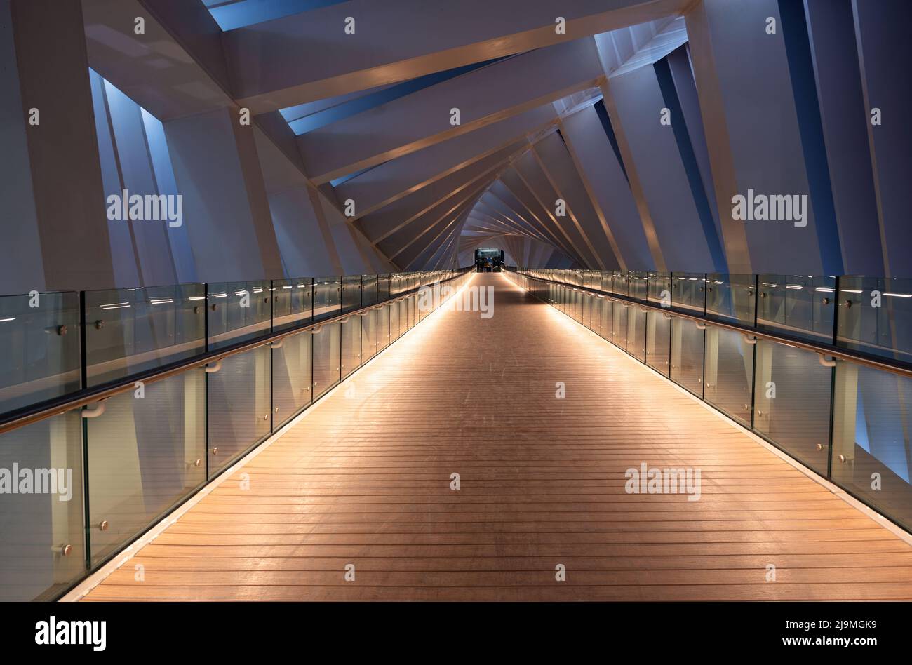 Beautiful view of the illuminated twisted bridge at the Dubai canal ...
