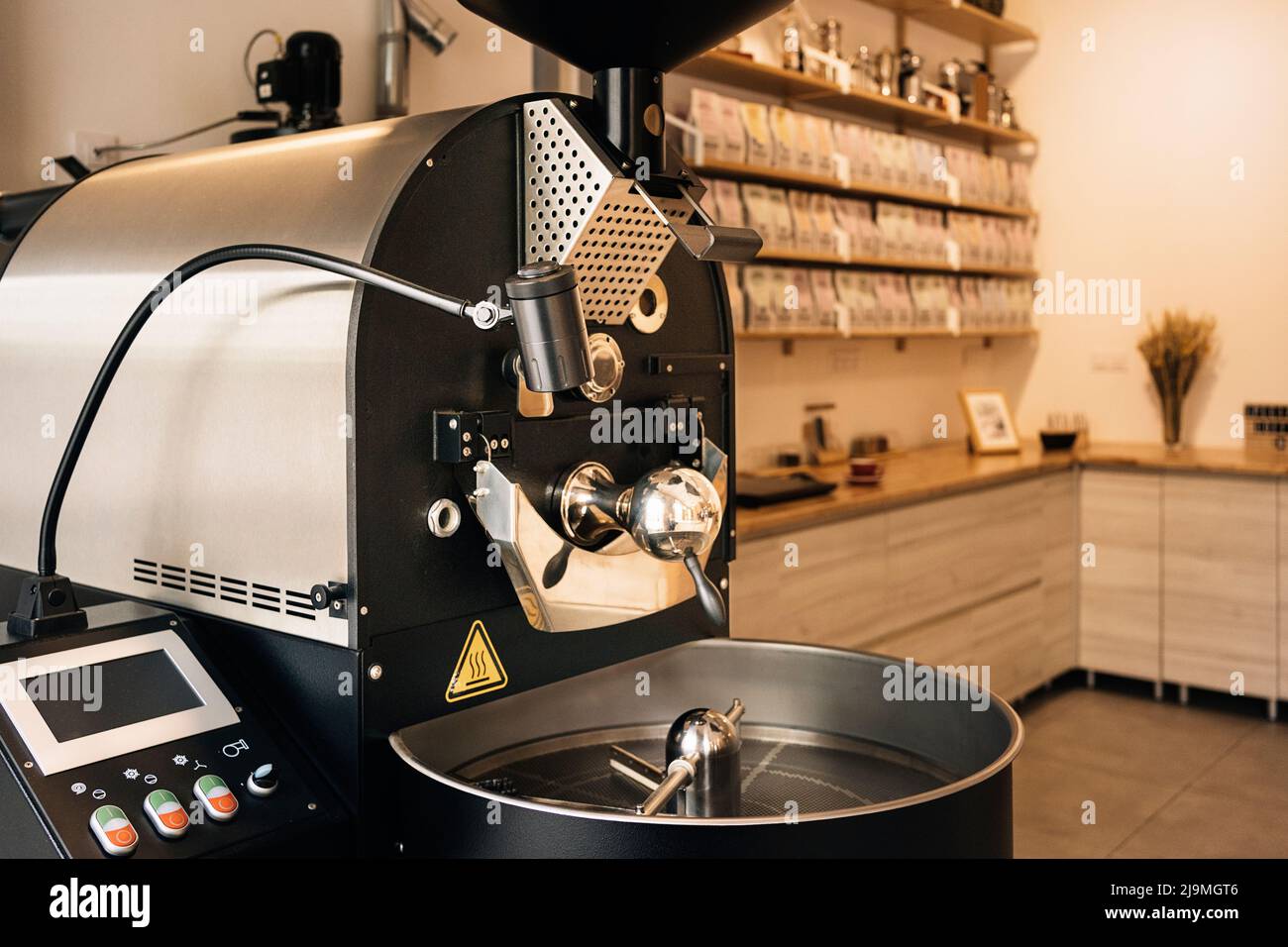 Modern stainless steel professional coffee roasting machine with chrome ...