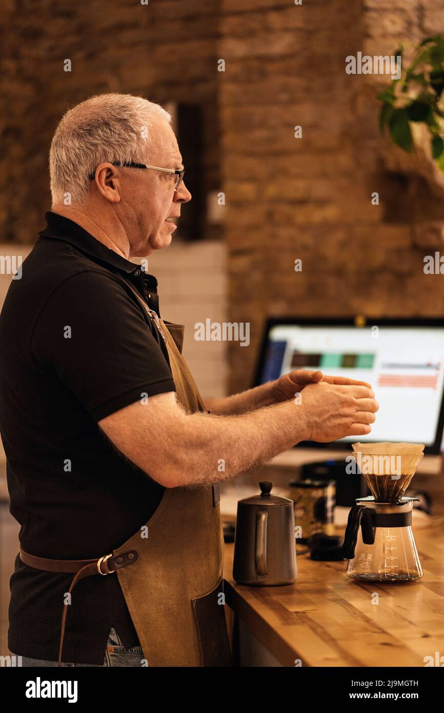 Senior mature man pour coffee hi-res stock photography and images - Alamy