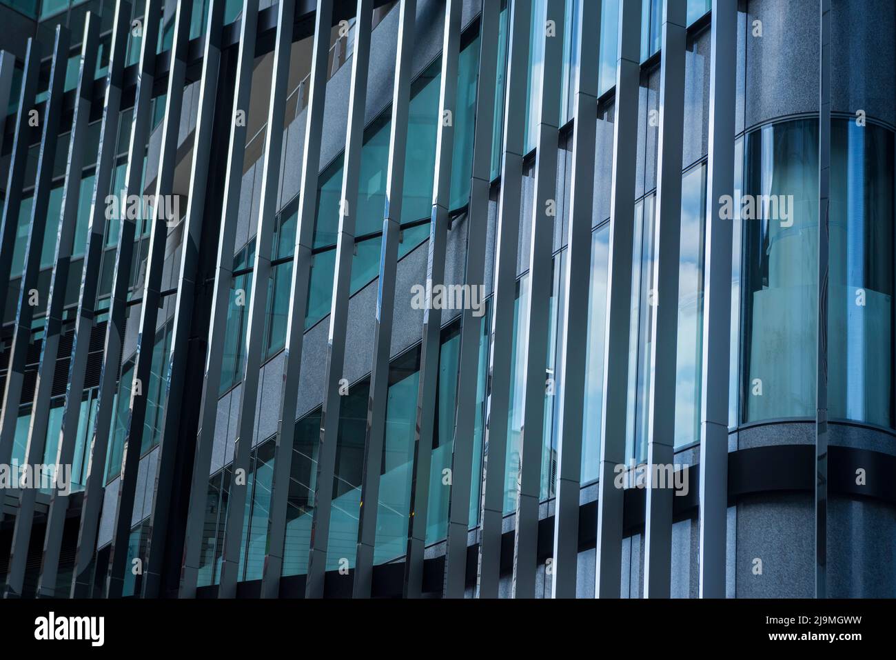 Commercial real estate, vertical vanes of stainless steel and glass ...