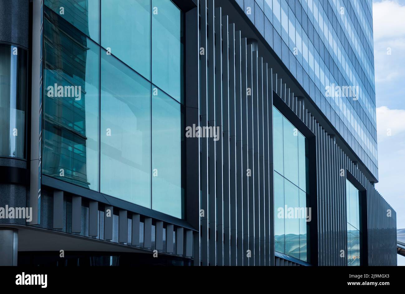 Commercial real estate, vertical vanes of stainless steel and glass ...