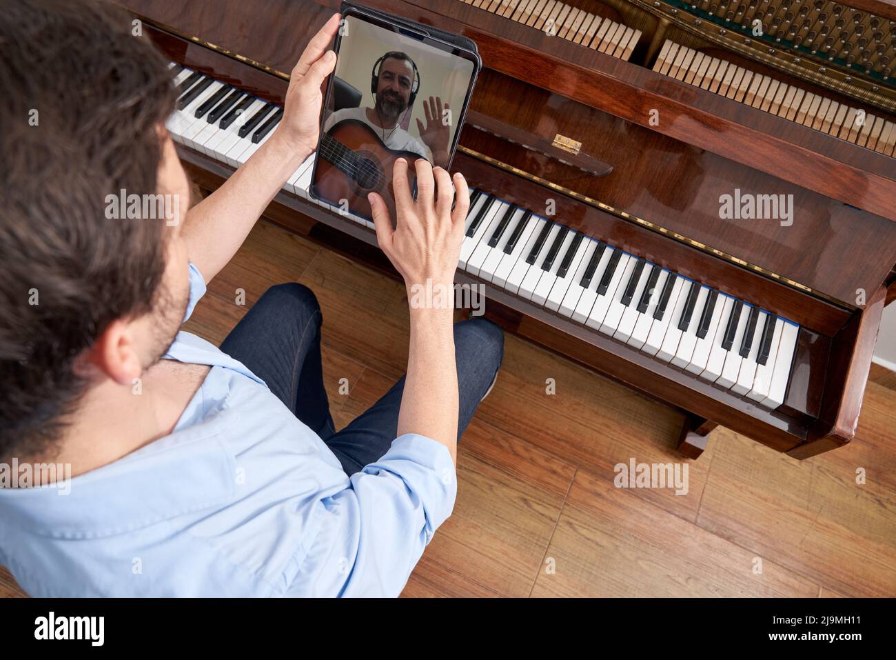 Person Playing Piano Back View