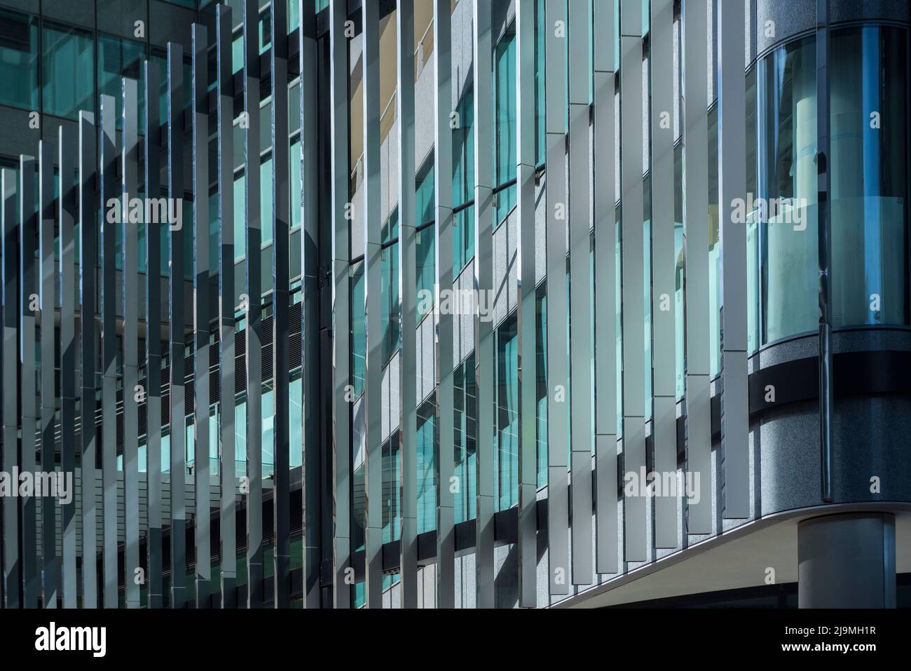 Commercial real estate, vertical vanes of stainless steel and glass ...