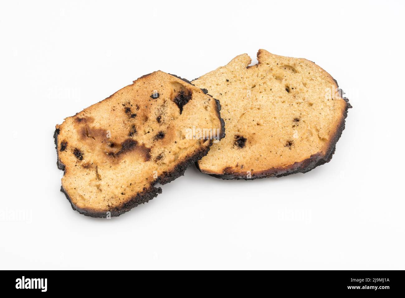 Bread which has been overcooked and burnt to a cinder on one side. For ...
