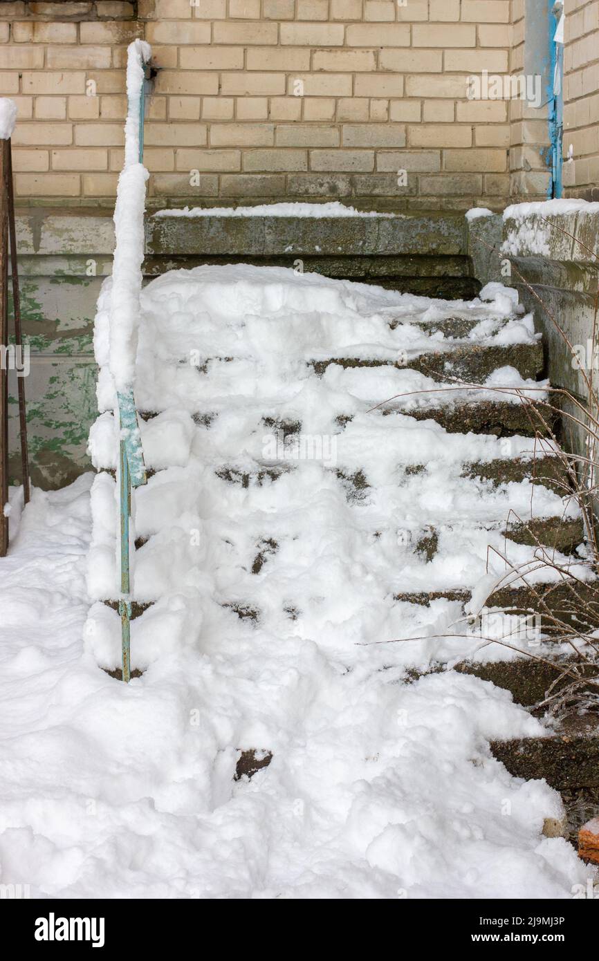 Iced stairs. Snow covered entrance. Old steps Stock Photo - Alamy