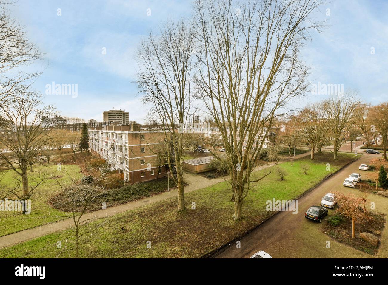 From above of balcony overlooking on park, residential buildings houses ...