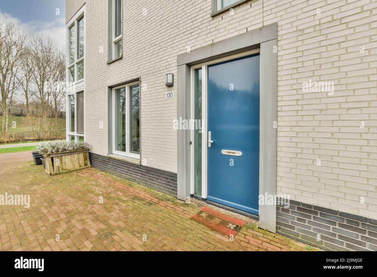 Facade of residential building entrance door located on street with ...