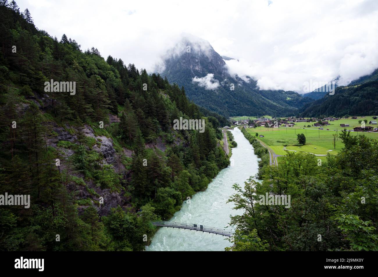 View of Aare Gorge, blue alpine river between narrow rocky cliffs ...