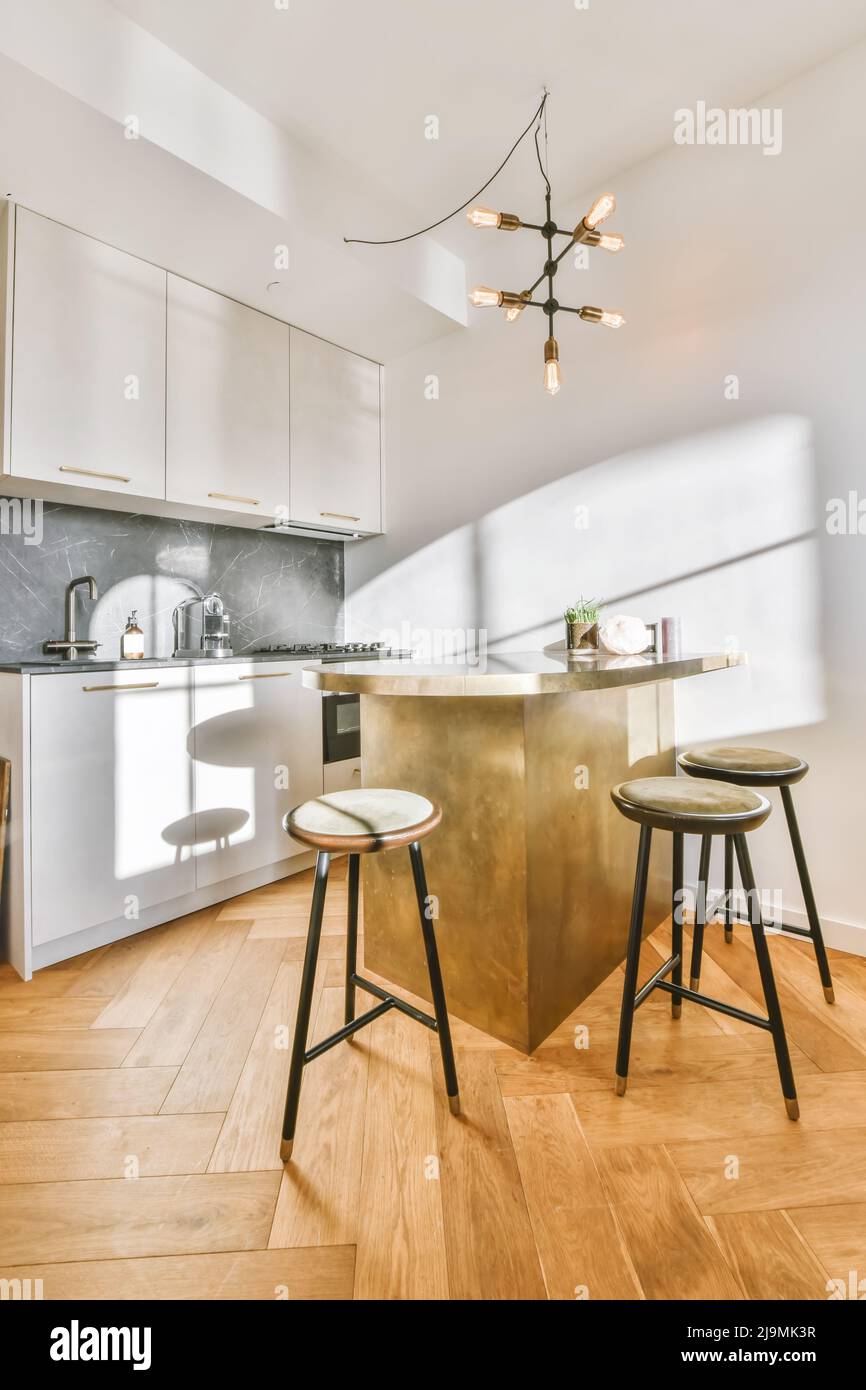 Contemporary counters with kitchen island located in middle of light ...