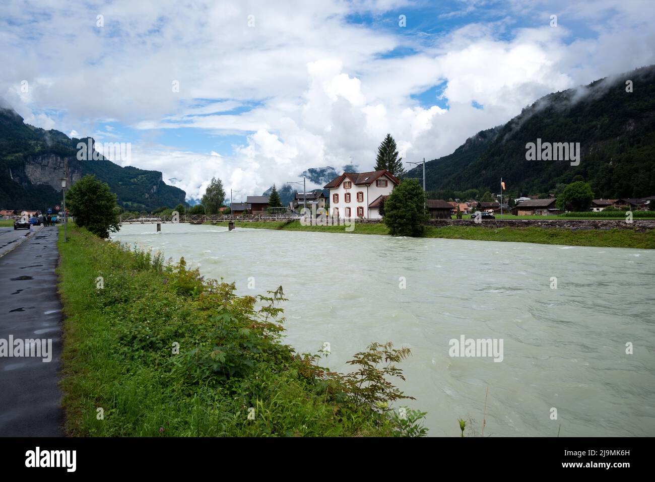 Aare the blue alpine river between narrow rocky cliffs covered with ...