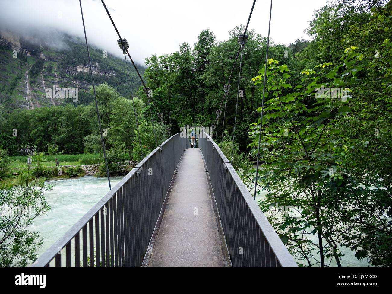 View of the beautiful rope suspension bridge across the Aare river ...