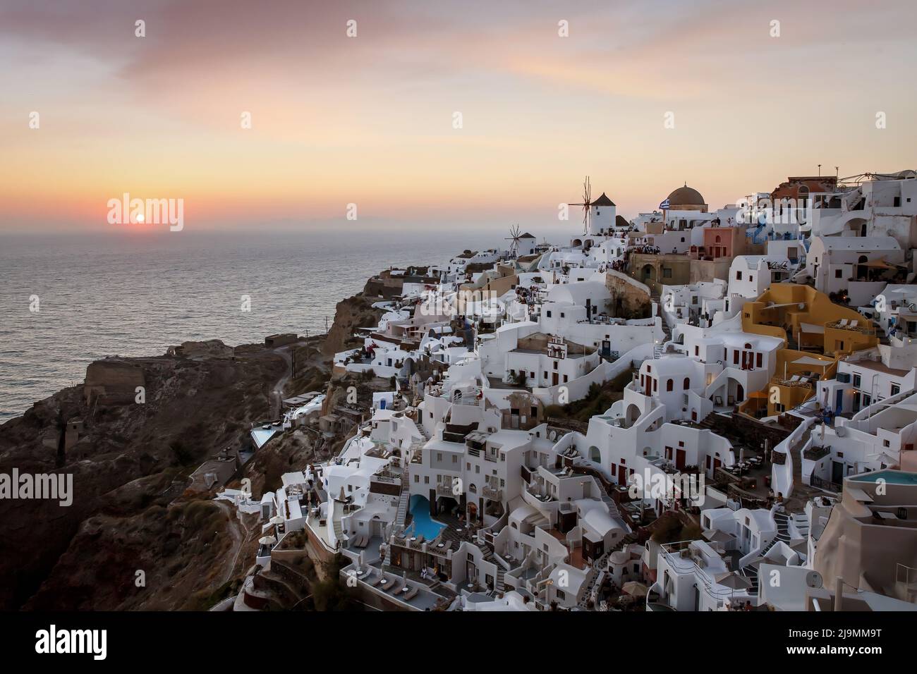 Santorini view. Oia village on sunset. White buildings architecture ...
