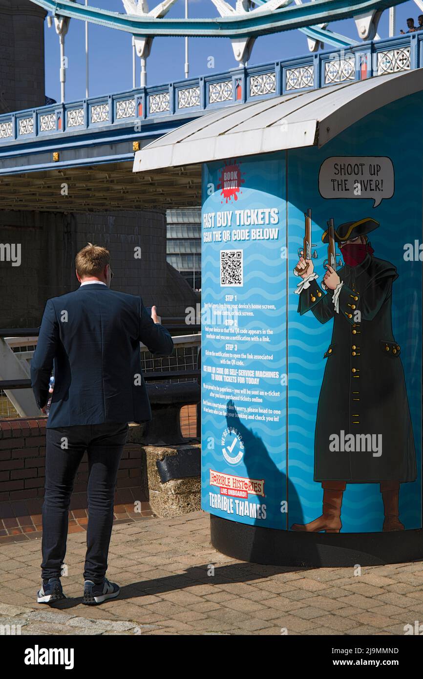 Man purchasing Boat Ticket Using Mobile Phone Vending Machine Tower ...