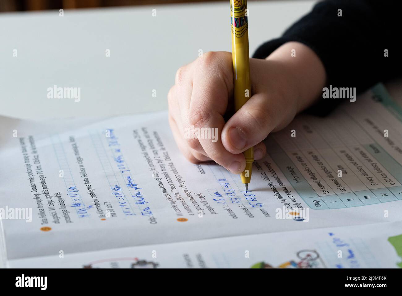 Warsaw, Poland - May 4, 2022: Home schooling. A child doing homework ...
