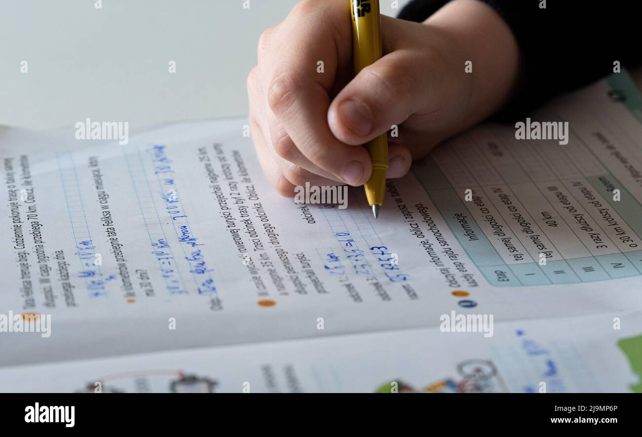 Warsaw, Poland - May 4, 2022: Home schooling. A child doing homework ...