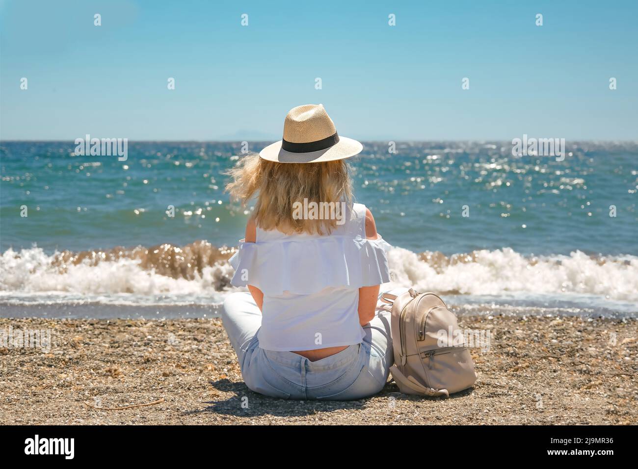 Woman back view seaside hi-res stock photography and images - Alamy