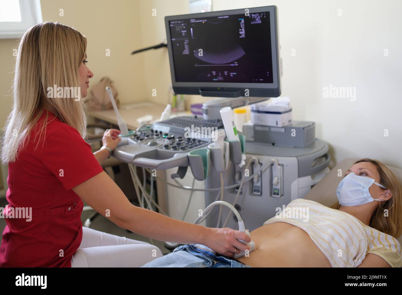 Gynecologist doing ultrasound scan in modern clinic Stock Photo - Alamy